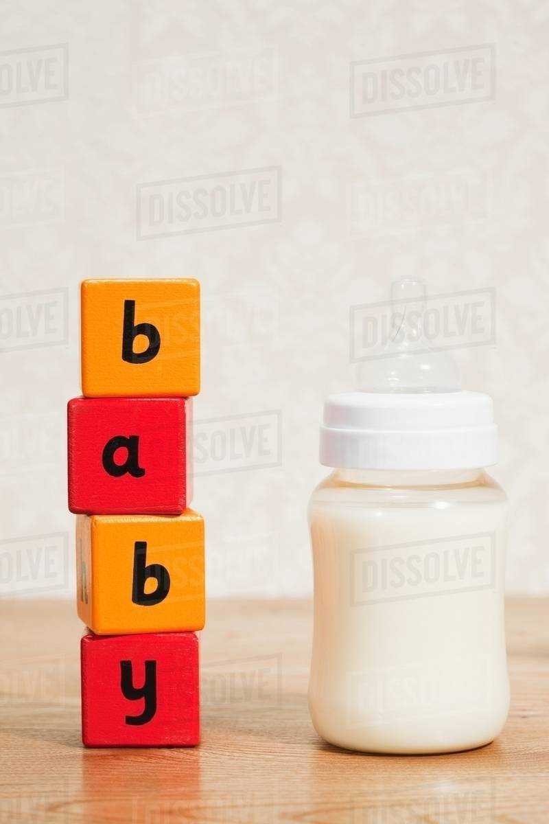 Baby formula and alphabet blocks - Royalty-free Stock Photo | Dissolve