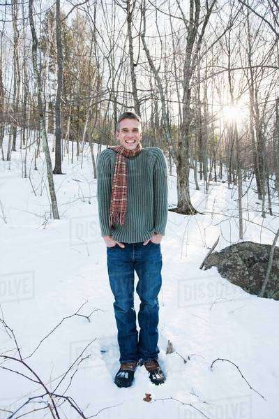 Man standing in snow, portrait - Royalty-free Stock Photo | Dissolve