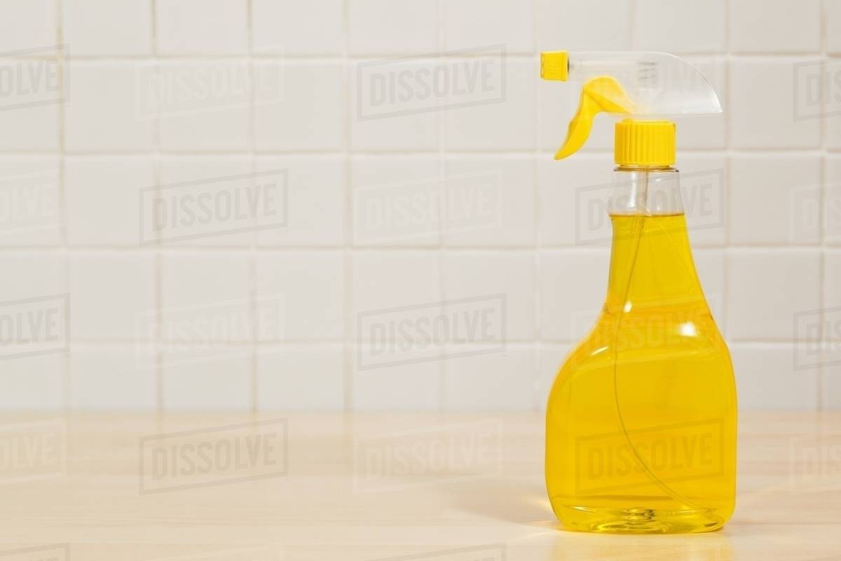 Bottle of yellow cleaning fluid - Royalty-free Stock Photo | Dissolve