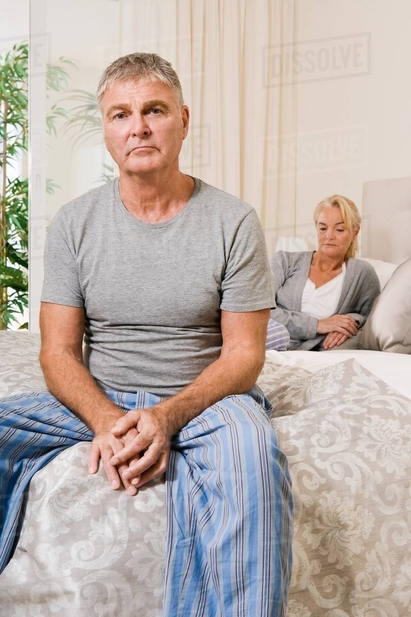 Worried couple in bedroom - Royalty-free Stock Photo | Dissolve