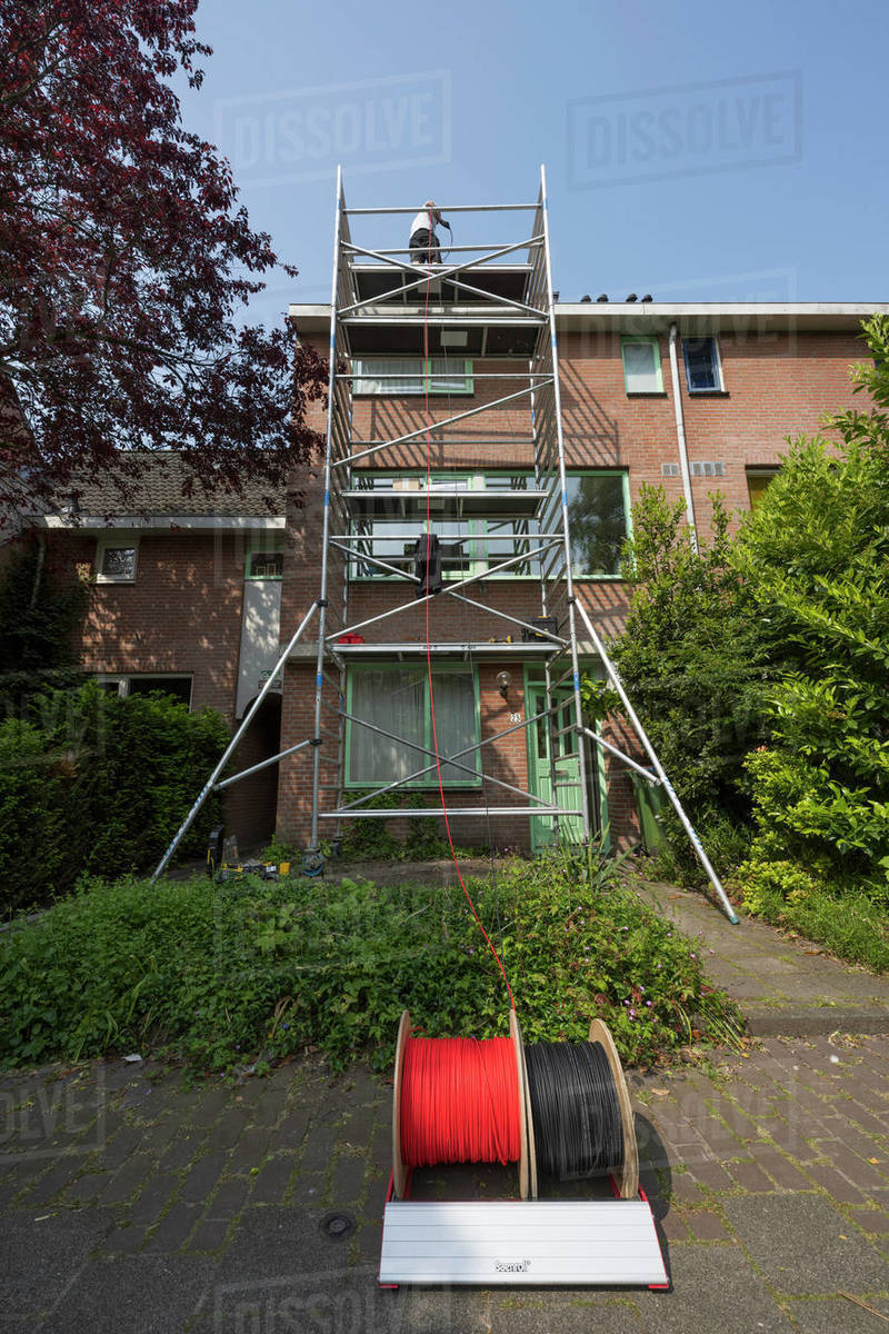 Scaffolding in front of house - Royalty-free Stock Photo | Dissolve