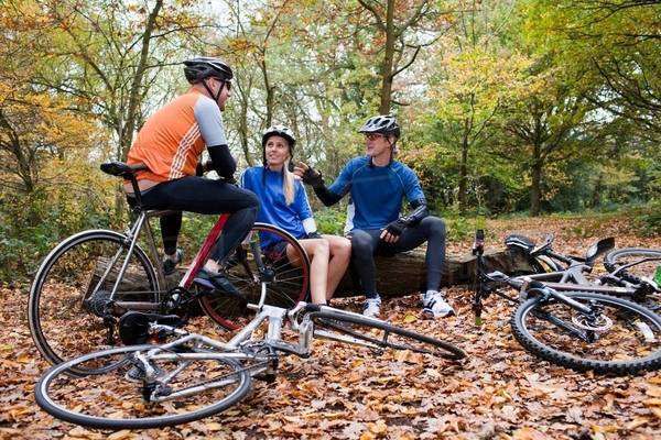 Cyclists in park, taking a break - Royalty-free Stock Photo | Dissolve