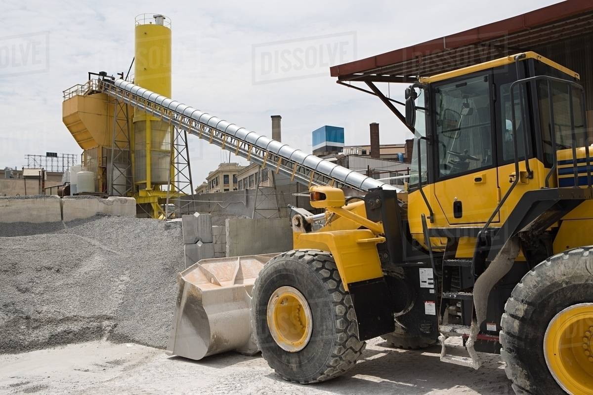 Digger parked in quarry - Stock Photo - Dissolve