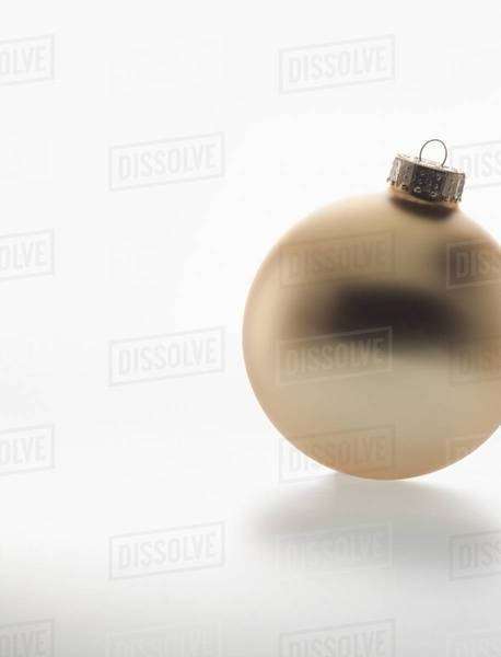 Single gold bauble - Stock Photo - Dissolve