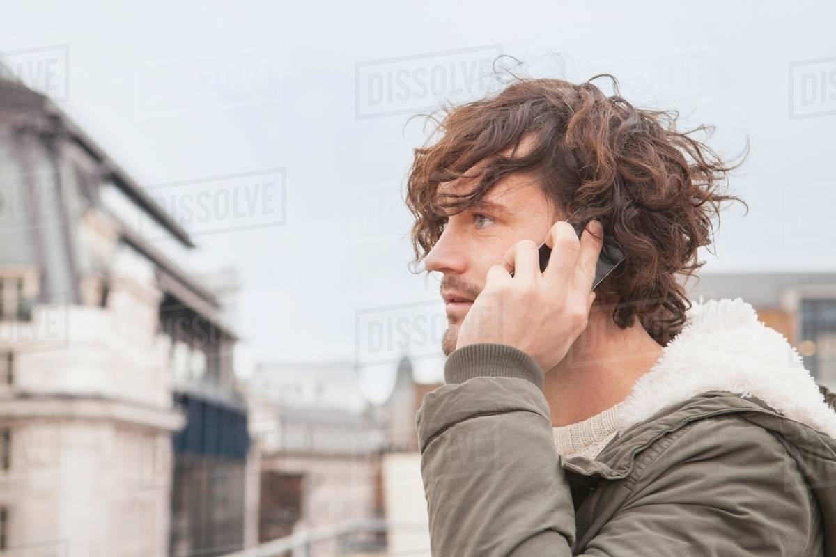 Young man on cell phone - Stock Photo - Dissolve