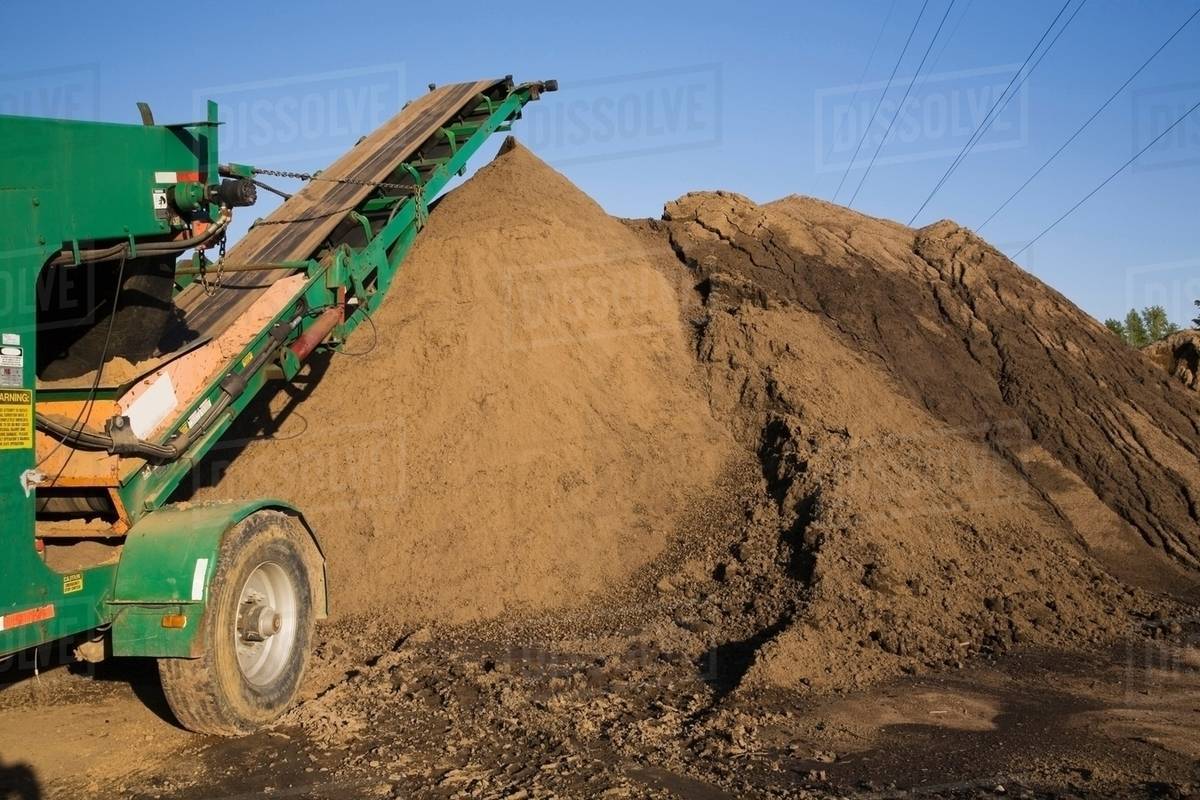 Sand and stacking conveyor in commercial sand pit - Stock Photo - Dissolve