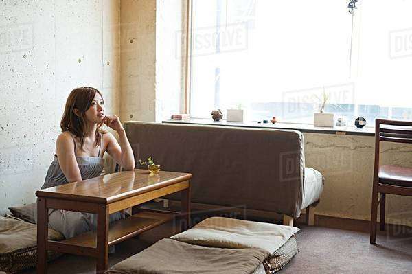 Young woman in room - Royalty-free Stock Photo | Dissolve