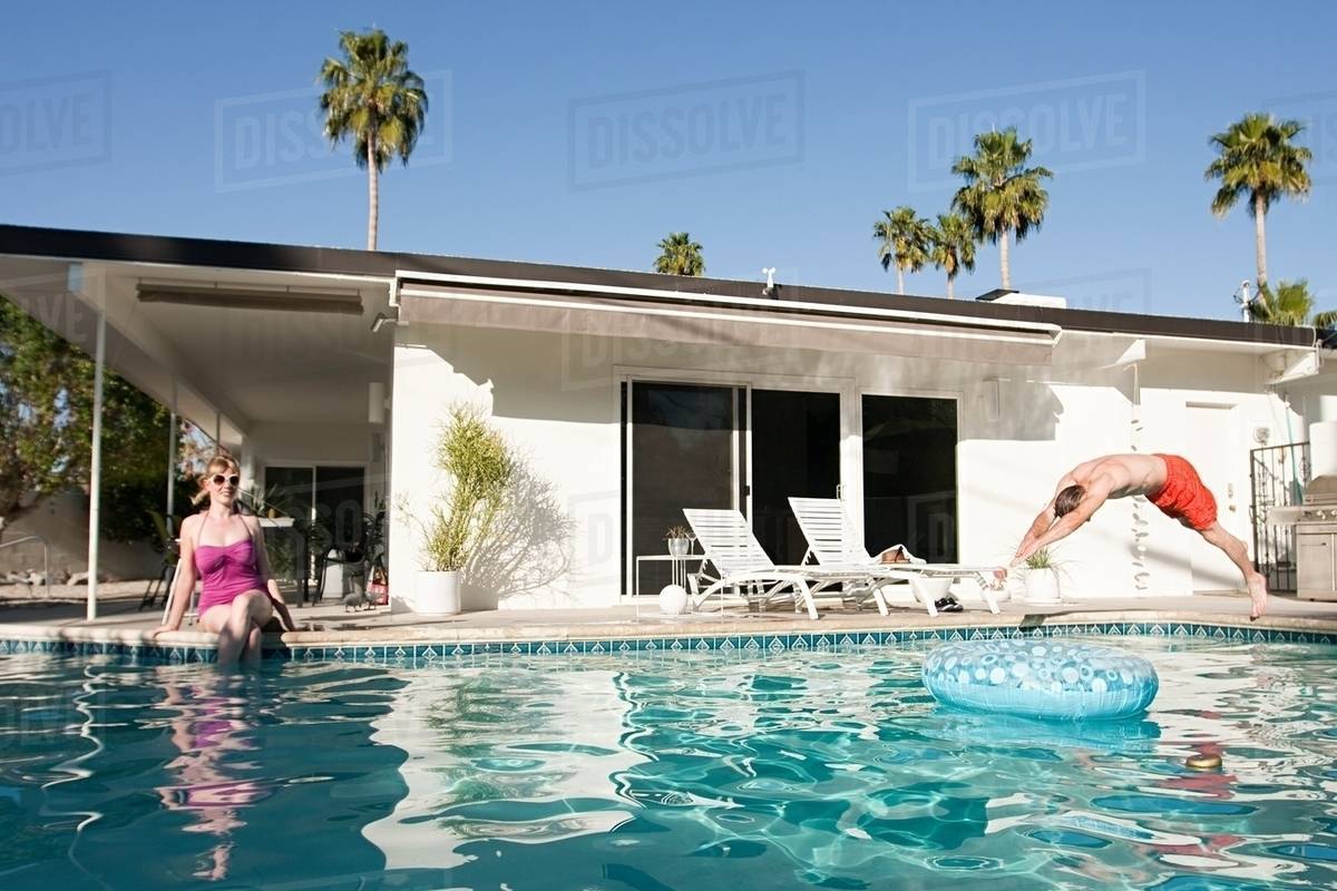 Family and outdoor swimming pool - Royalty-free Stock Photo | Dissolve