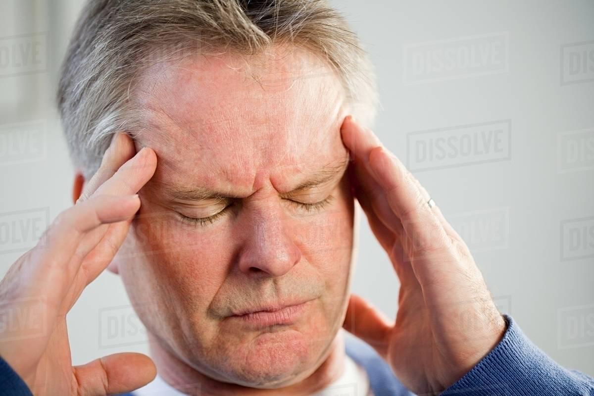 Man with a headache - Stock Photo - Dissolve