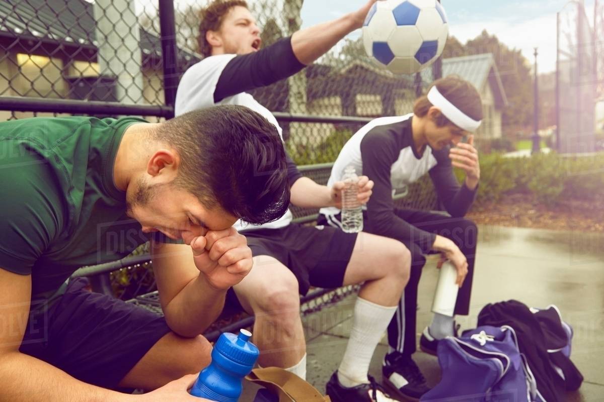 Three disappointed male soccer player spectators - Royalty-free Stock ...