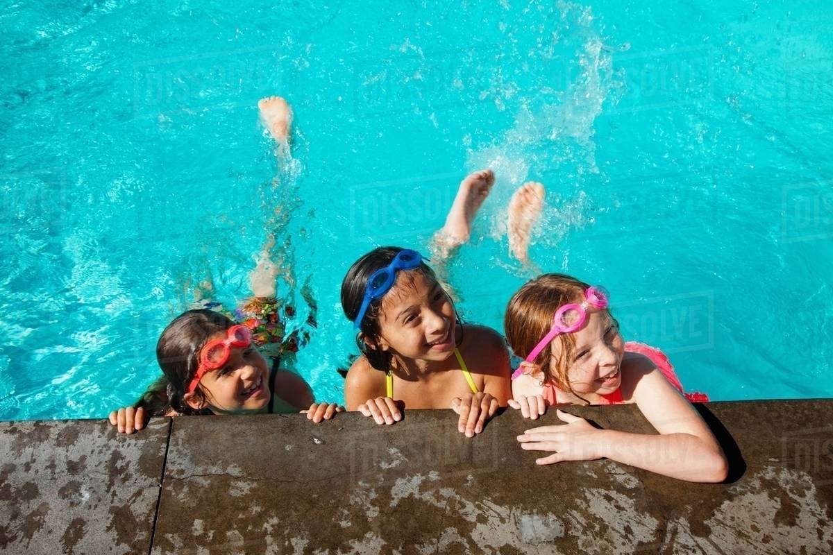 Girls at poolside - Royalty-free Stock Photo | Dissolve