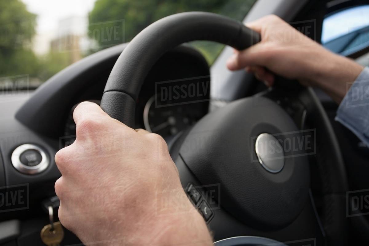 Hands on a steering wheel - Royalty-free Stock Photo | Dissolve