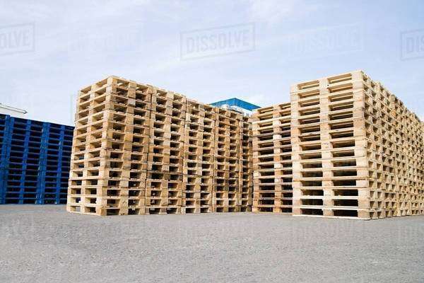 Stacks of wooden pallets - Royalty-free Stock Photo | Dissolve