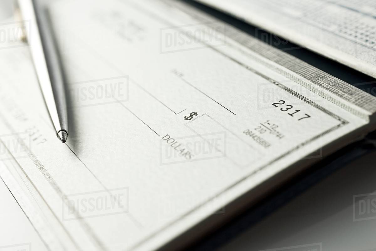 Cheque book and pen - Royalty-free Stock Photo | Dissolve
