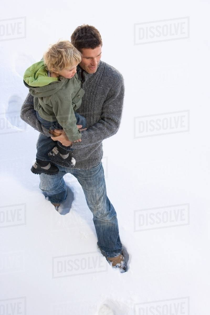 Father and son in snow - Royalty-free Stock Photo | Dissolve