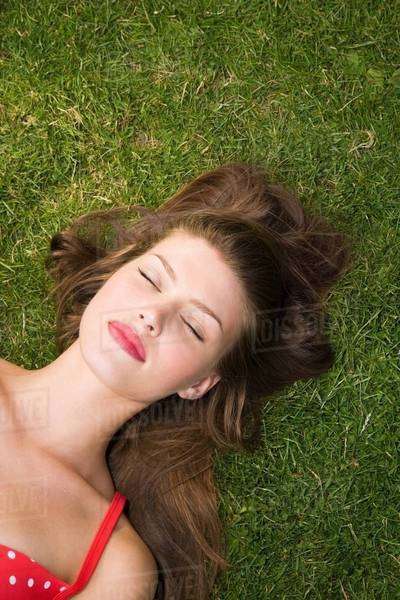 Woman sunbathing - Royalty-free Stock Photo | Dissolve