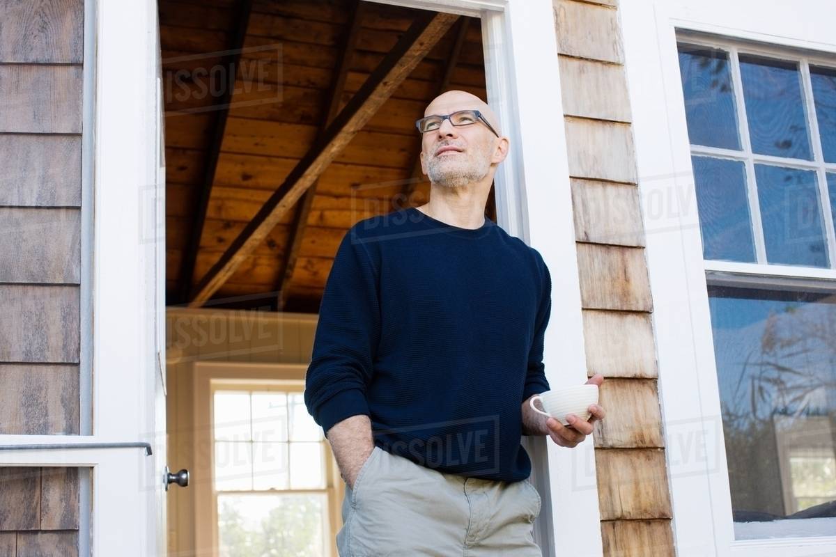 Man outside house - Royalty-free Stock Photo | Dissolve