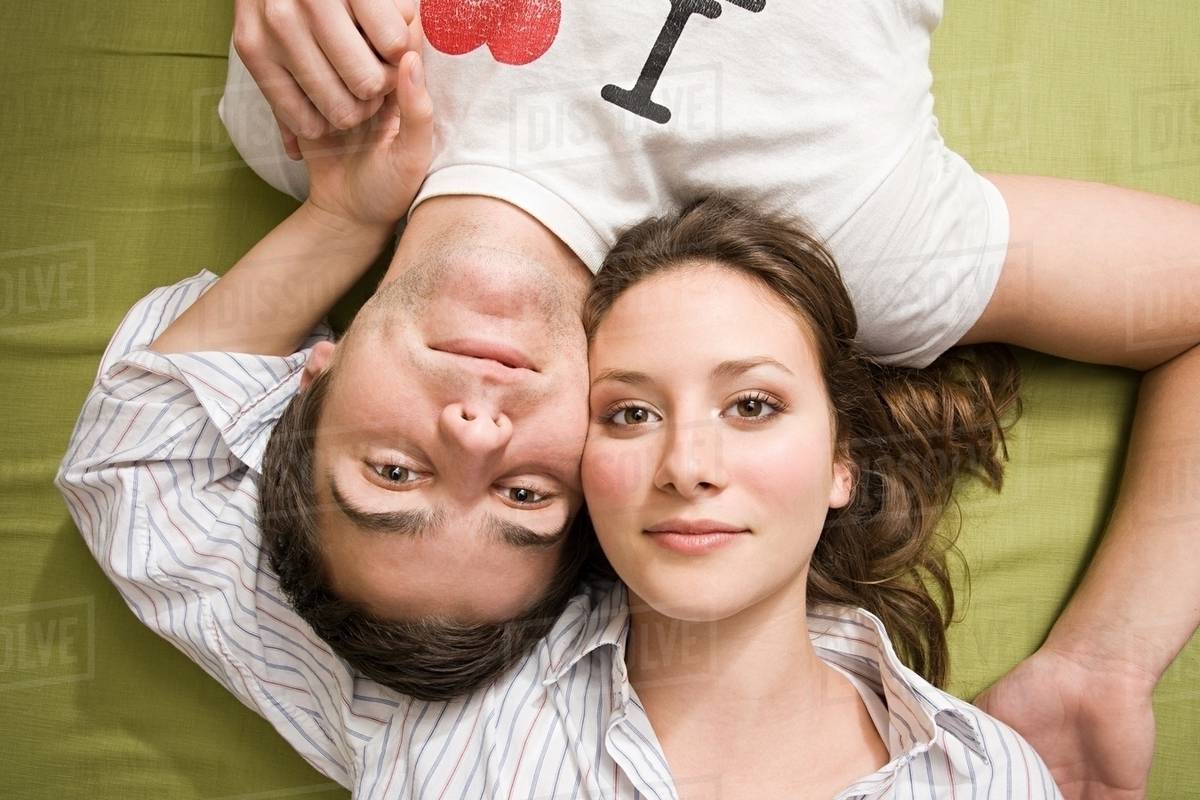 Portrait of a couple lying down - Royalty-free Stock Photo | Dissolve