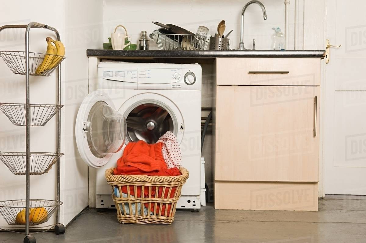 Washing machine in kitchen - Royalty-free Stock Photo | Dissolve