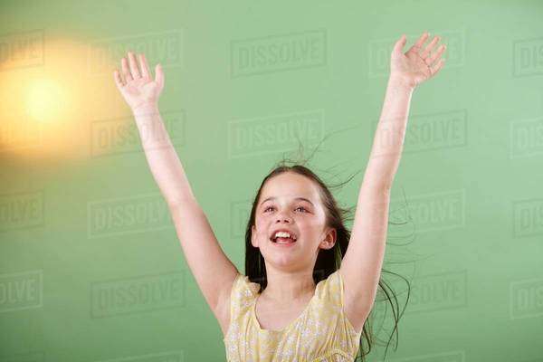 Girl with arms raised - Royalty-free Stock Photo | Dissolve