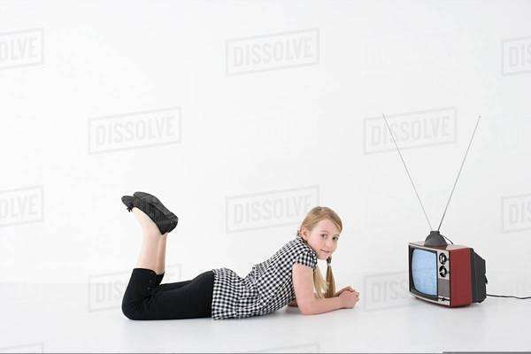 Girl with television - Stock Photo - Dissolve