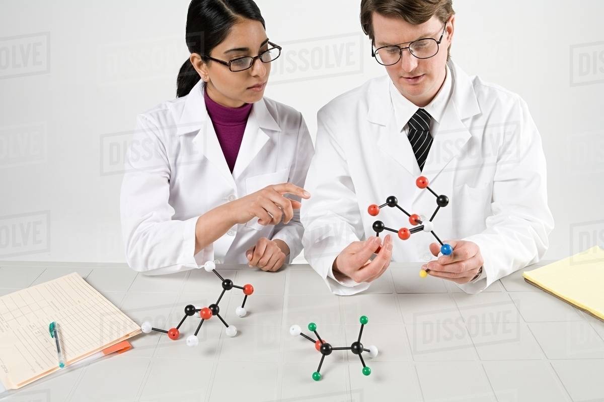 Scientists with molecule models - Royalty-free Stock Photo | Dissolve