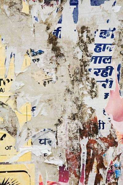 Torn posters on a wall - Stock Photo - Dissolve