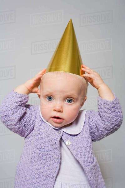 Baby with a party hat - Royalty-free Stock Photo | Dissolve