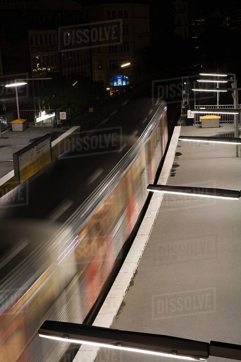 Train going through a railway station - Royalty-free Stock Photo | Dissolve