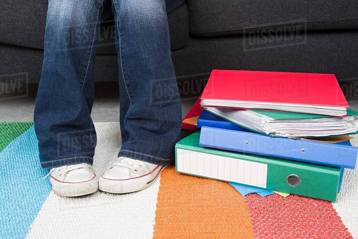 Human legs and ring binders - Royalty-free Stock Photo | Dissolve