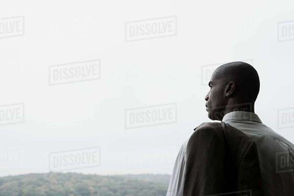 A businessman holding a jacket - Royalty-free Stock Photo | Dissolve