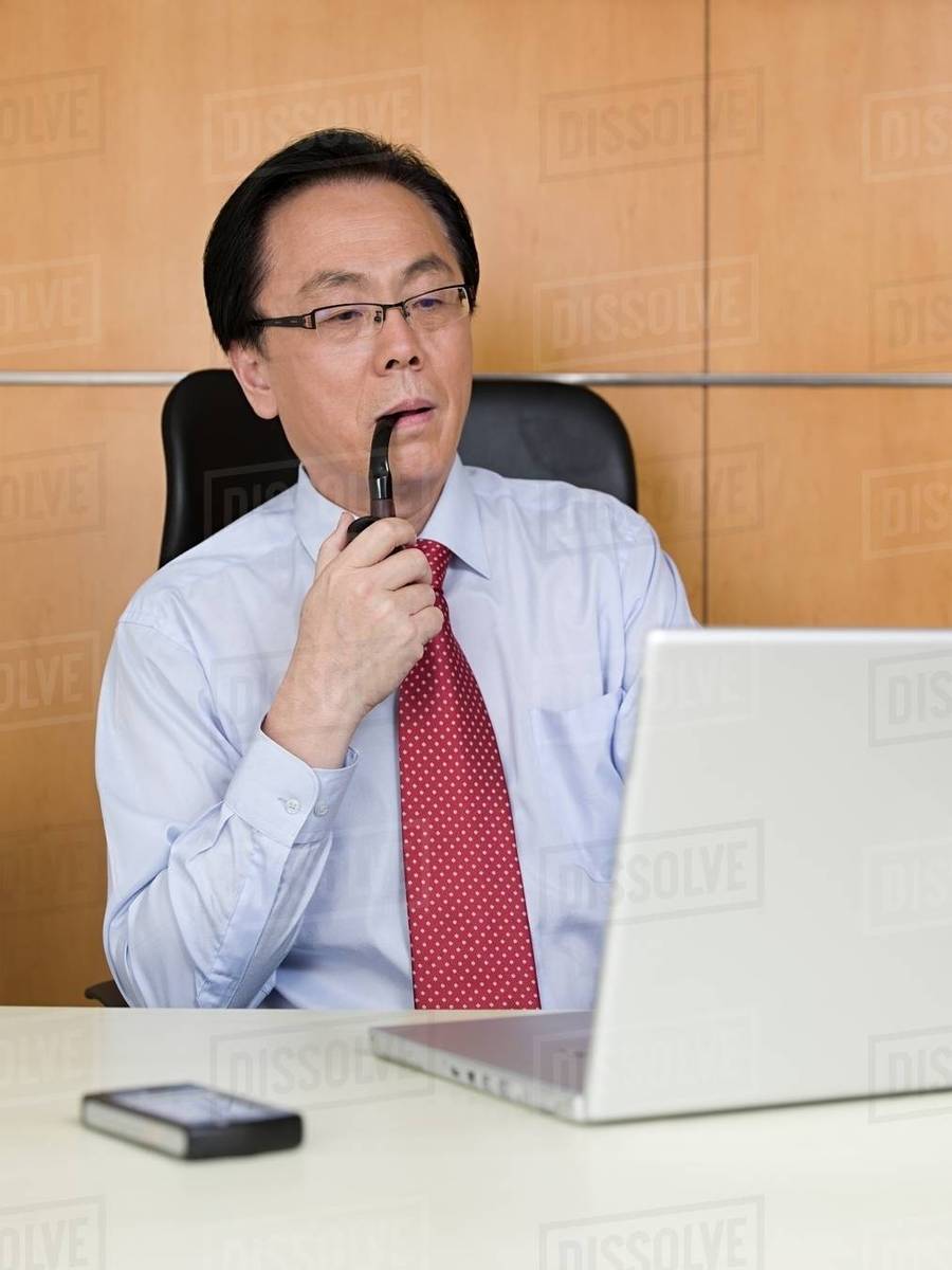 Businessman with pipe - Royalty-free Stock Photo | Dissolve