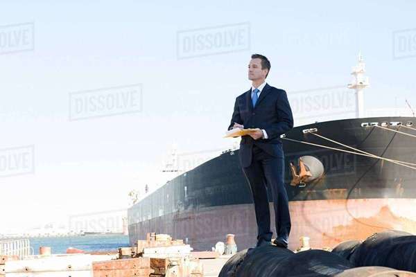 Businessman by ship - Royalty-free Stock Photo | Dissolve