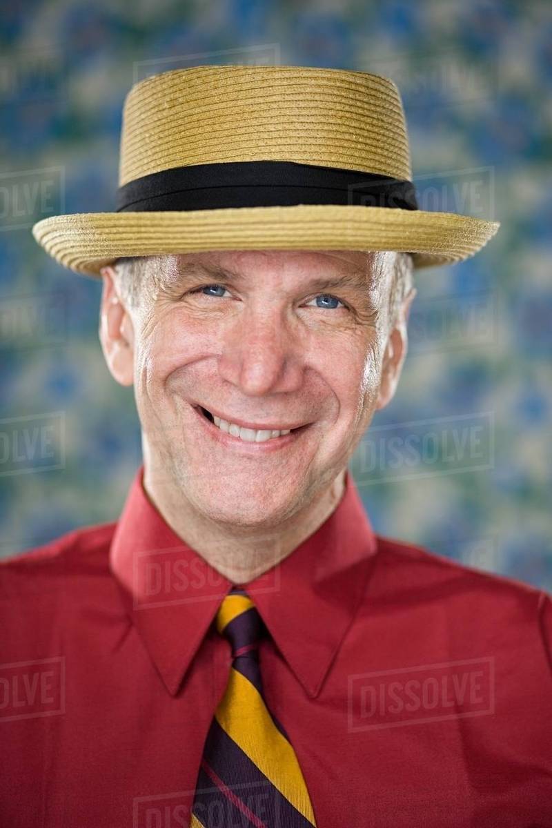 Man wearing straw hat - Royalty-free Stock Photo | Dissolve