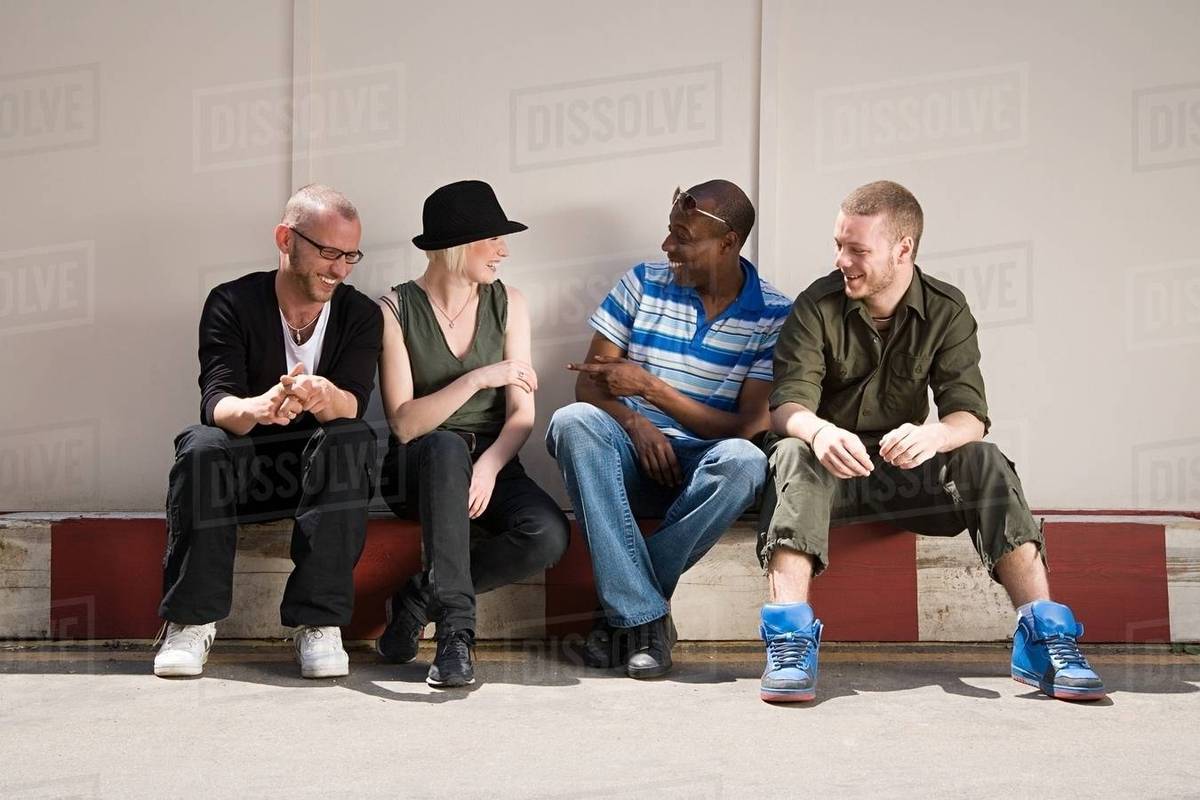 Four friends laughing - Stock Photo - Dissolve