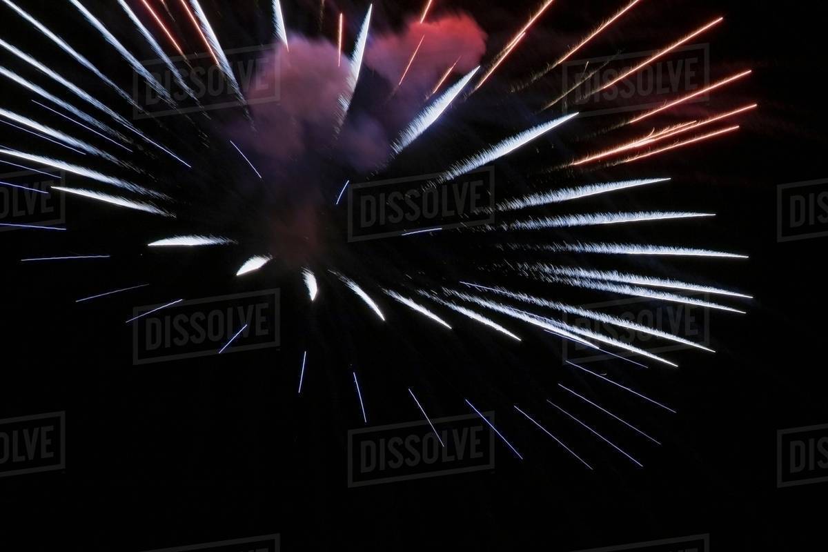 Fireworks exploding in night sky - Stock Photo - Dissolve
