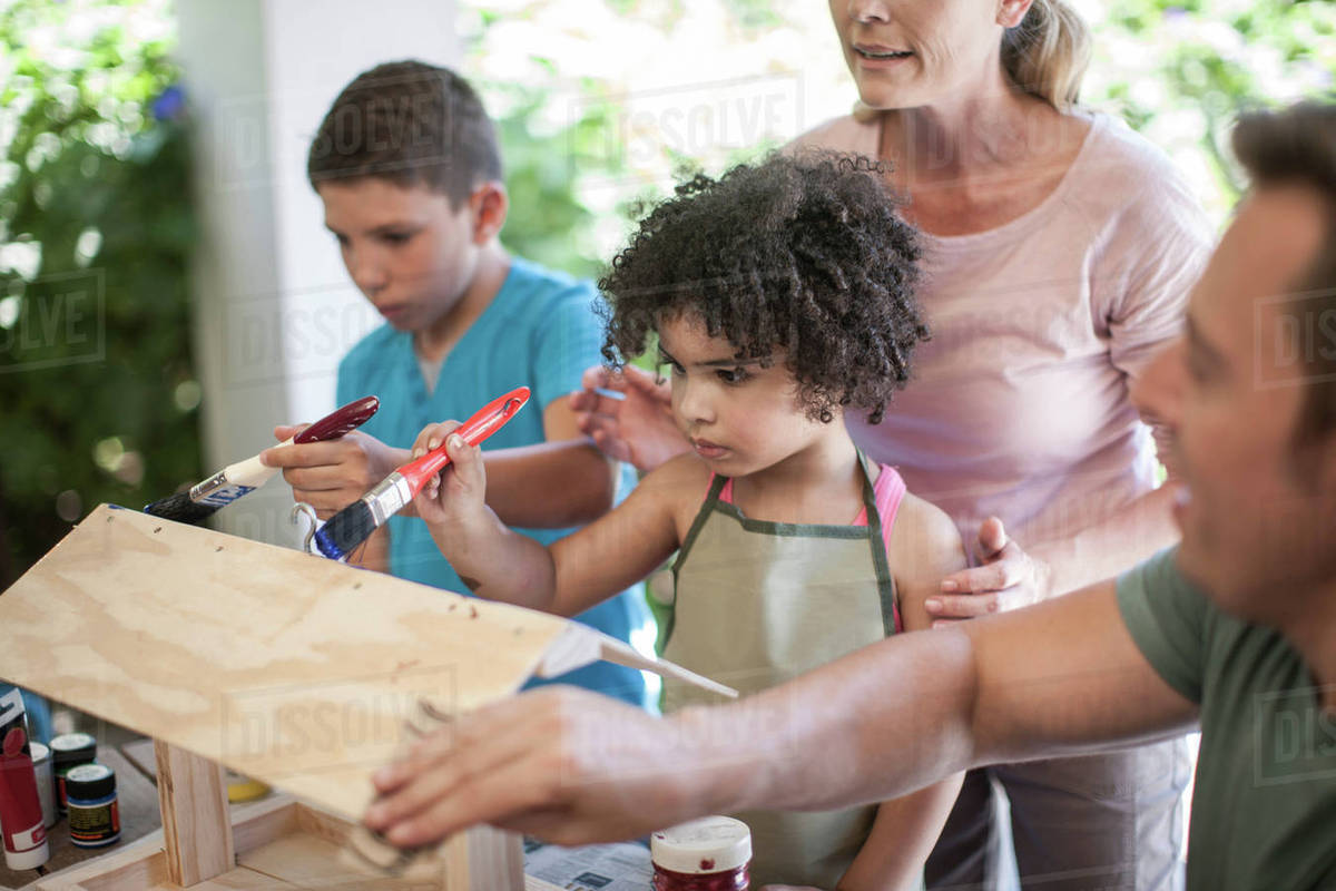 Family doing crafts together, making birdhouse - Royalty-free Stock ...
