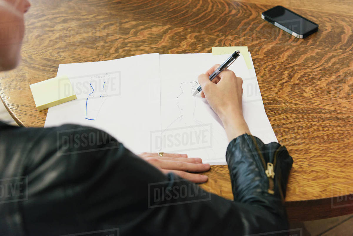 View over shoulder of woman writing - Royalty-free Stock Photo | Dissolve