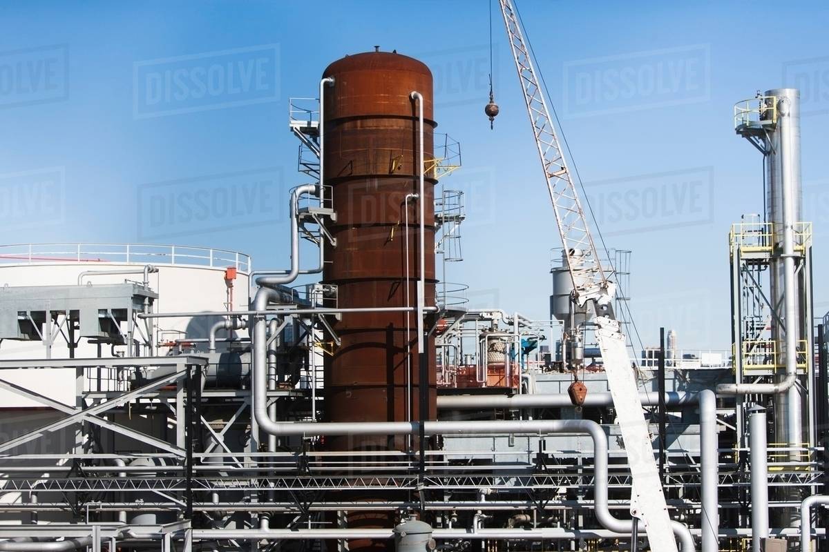 Storage tanks of oil refinery - Stock Photo - Dissolve