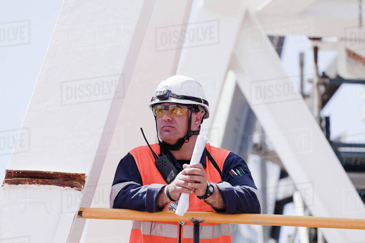Engineer working on oil rig - Stock Photo - Dissolve
