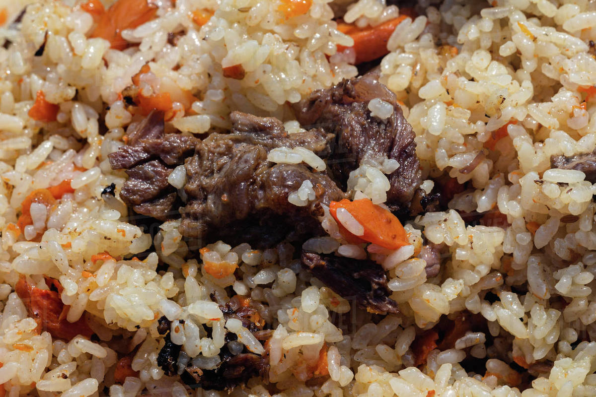 Traditional Eastern culinary dish - pilaf. Close-up view of Asian tasty ...