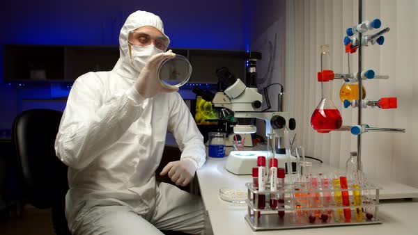 Scientist examining samples with microscope - Stock Video Footage ...