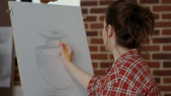 Portrait of art class student drawing vase model on canvas in creative ...