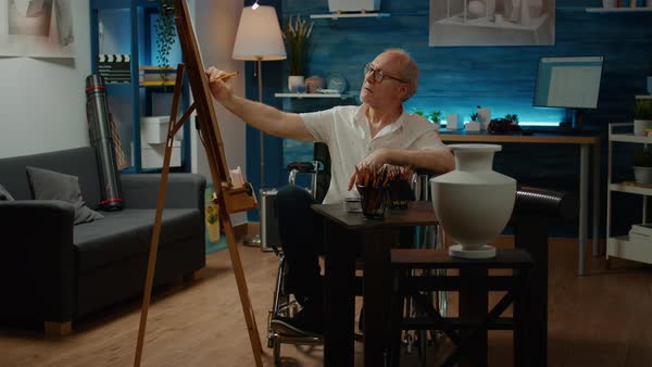 Paralyzed man with health condition drawing modern art model of ...