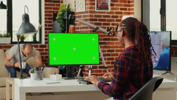 Office worker analyzing isolated greenscreen template on personal ...