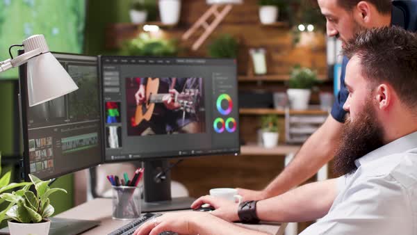 Professional colorist and video editor working on new music video in ...