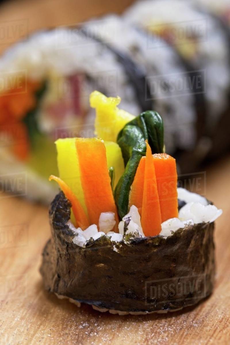 A close up of the end piece of a Korean treat called Kimbap. Food made ...