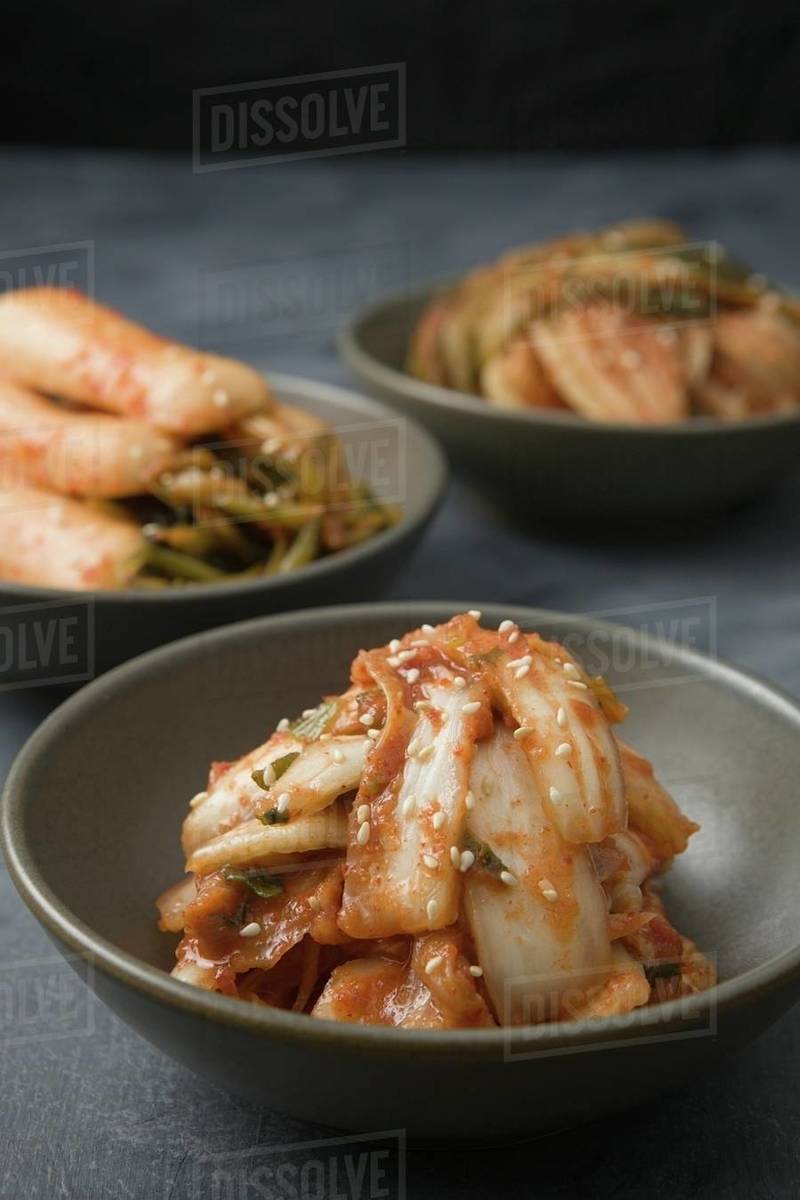A close up of various home made Korean Kimchi in bowls - Royalty-free ...