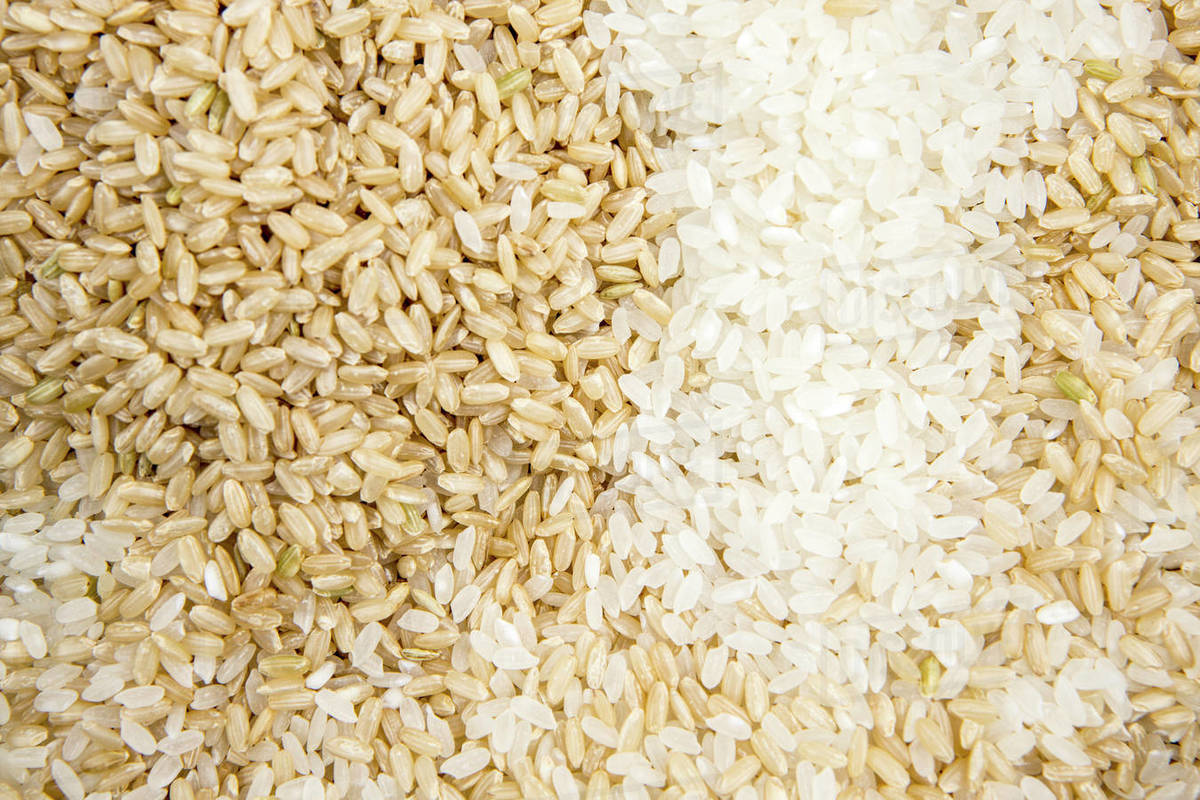 A mixture of raw uncooked white rice and brown rice. - Royalty-free ...