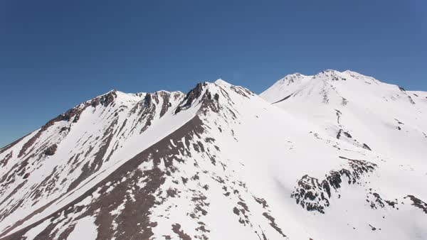 Cascade Mountains, circa-2019. Aerial view of Mount Shasta. Shot from ...